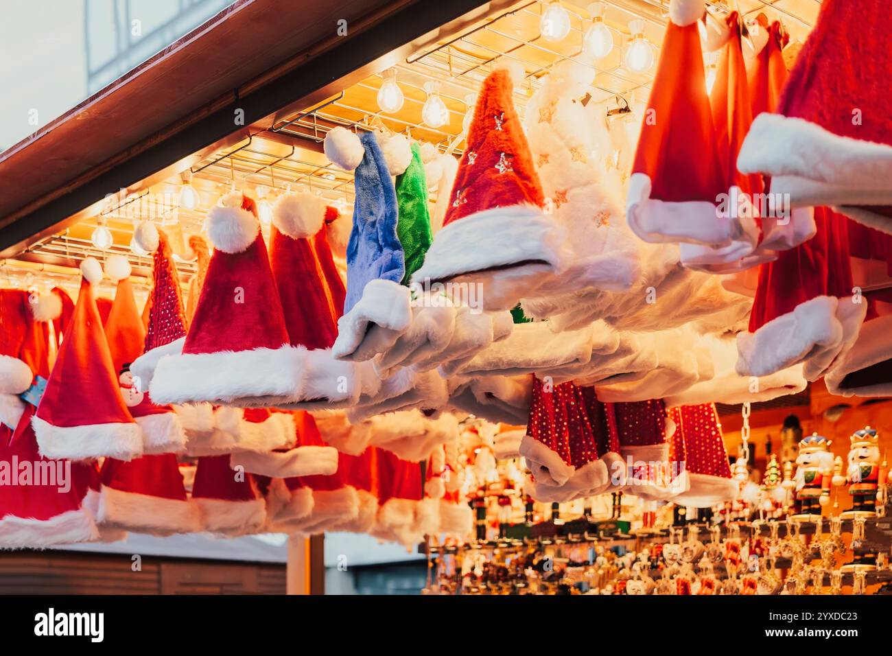Bright display of red and white Santa hats with festive lighting at ...