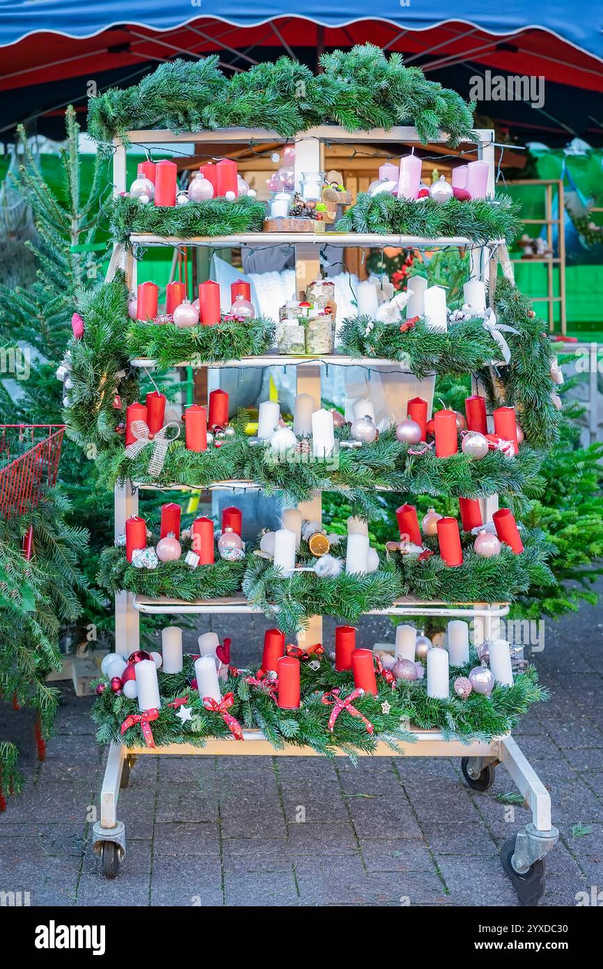 Festive market stall featuring Christmas wreaths with red and white ...