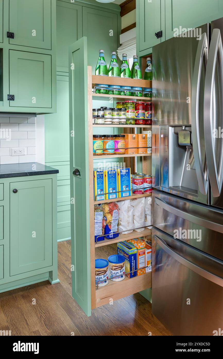 Narrow vertical drawer pulls out next to refrigerator to hold pantry ...