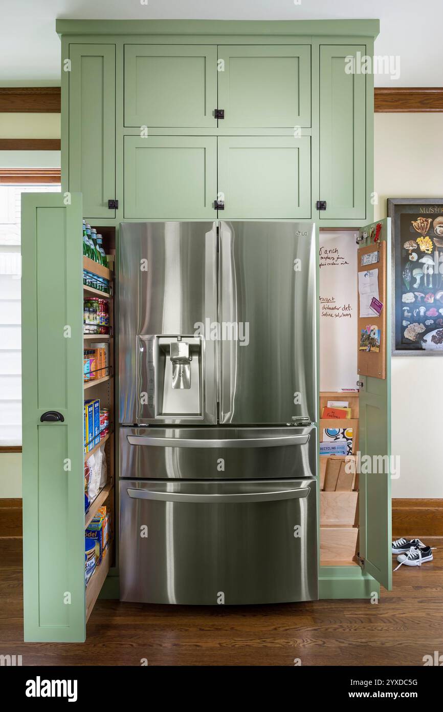 Custom built pantry cabinet surrounds LG French door refrigerator with ...