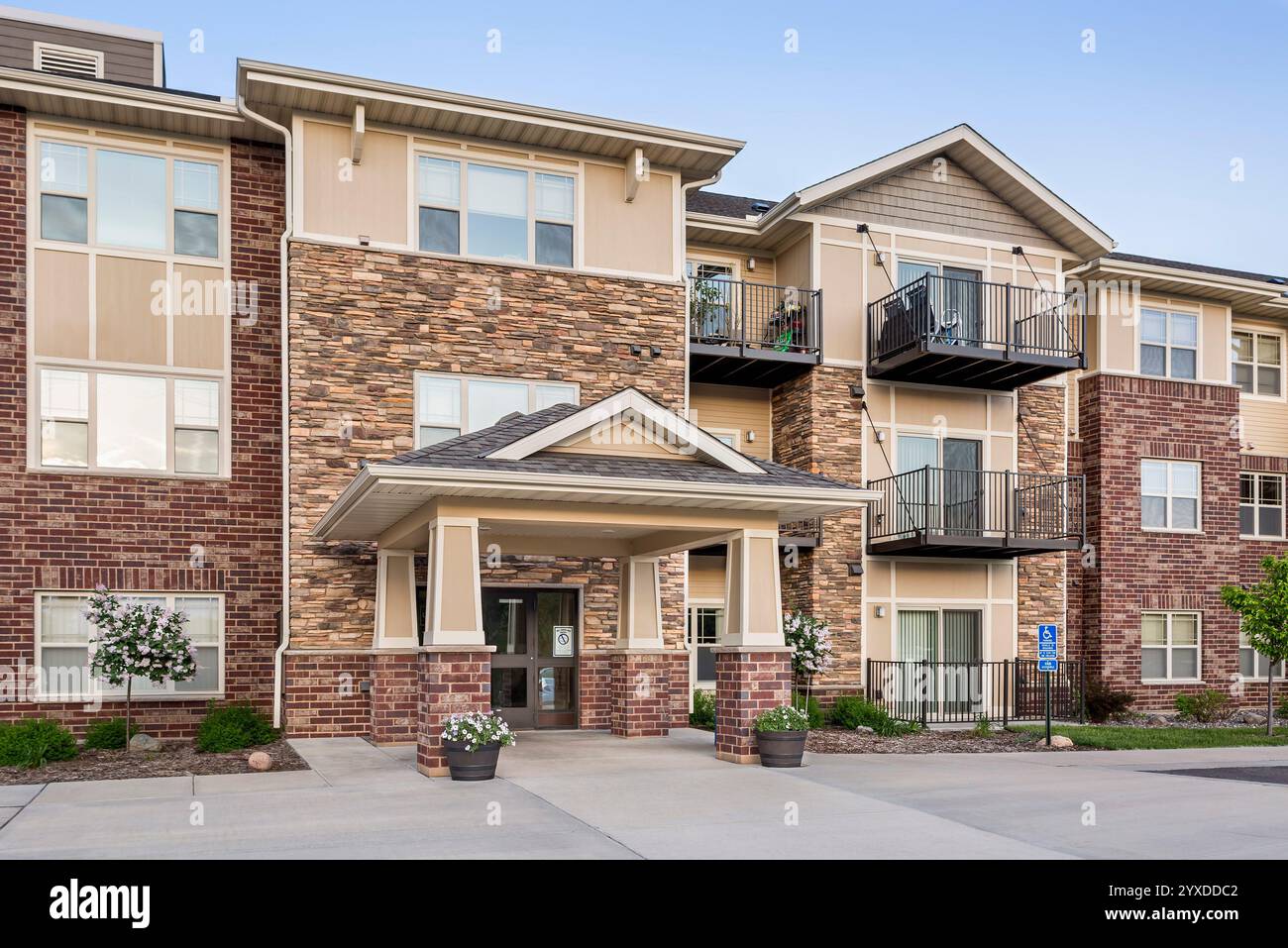 Front entrance to apartment building with canopy over door Stock Photo ...