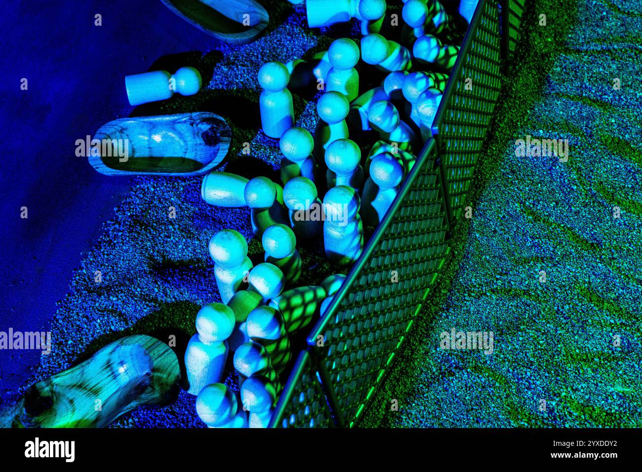 Wooden Boats and Figures in Blue Light Behind a Fence Stock Photo - Alamy