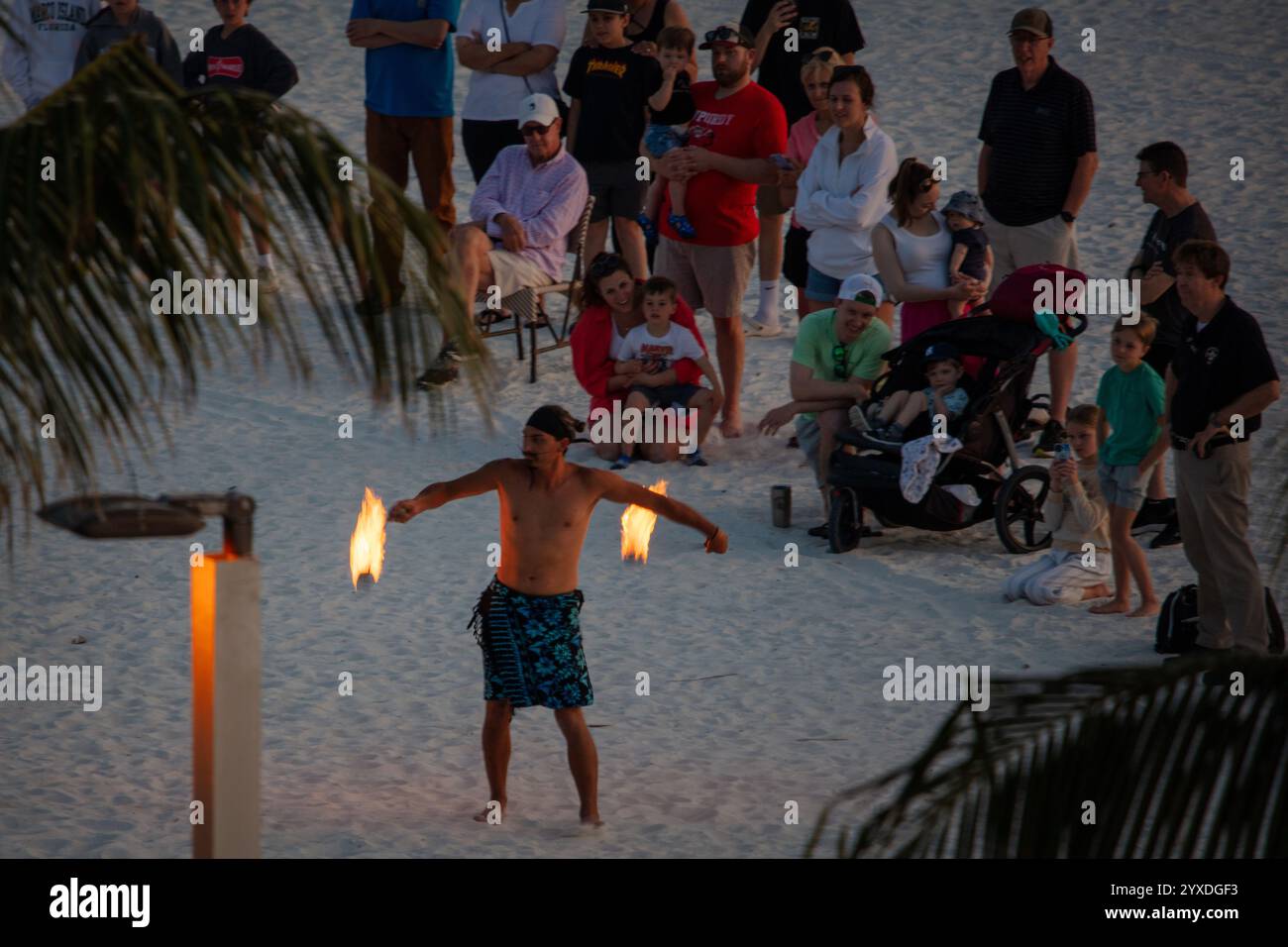 A fire performer on the beach in front of JW Marriott Marco Island ...