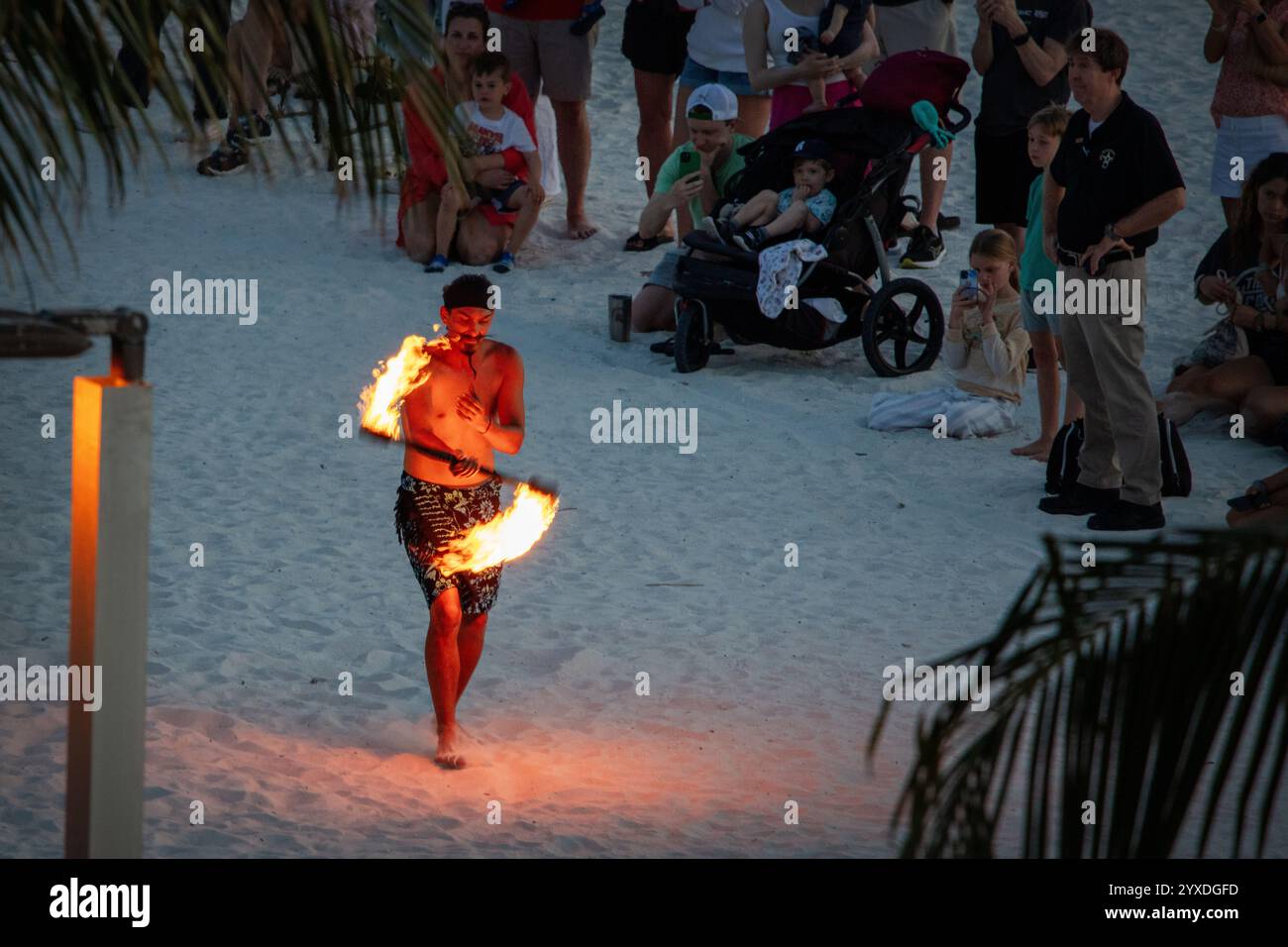 A fire performer on the beach in front of JW Marriott Marco Island ...