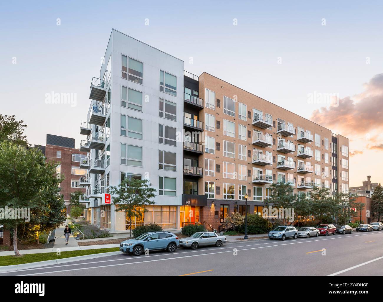 Front exterior of new brick and steel apartment building Stock Photo ...