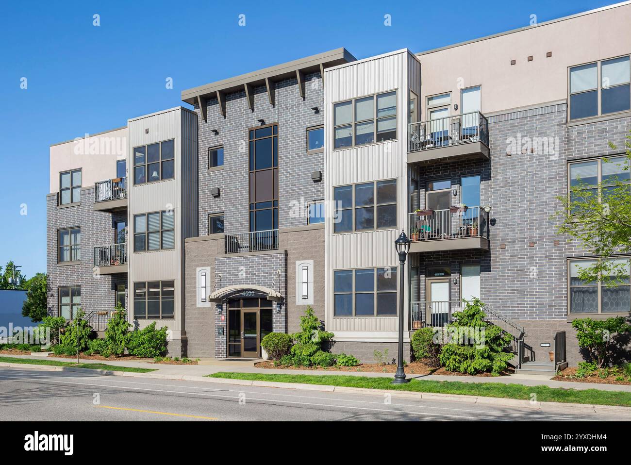 Front of new apartment building Stock Photo - Alamy