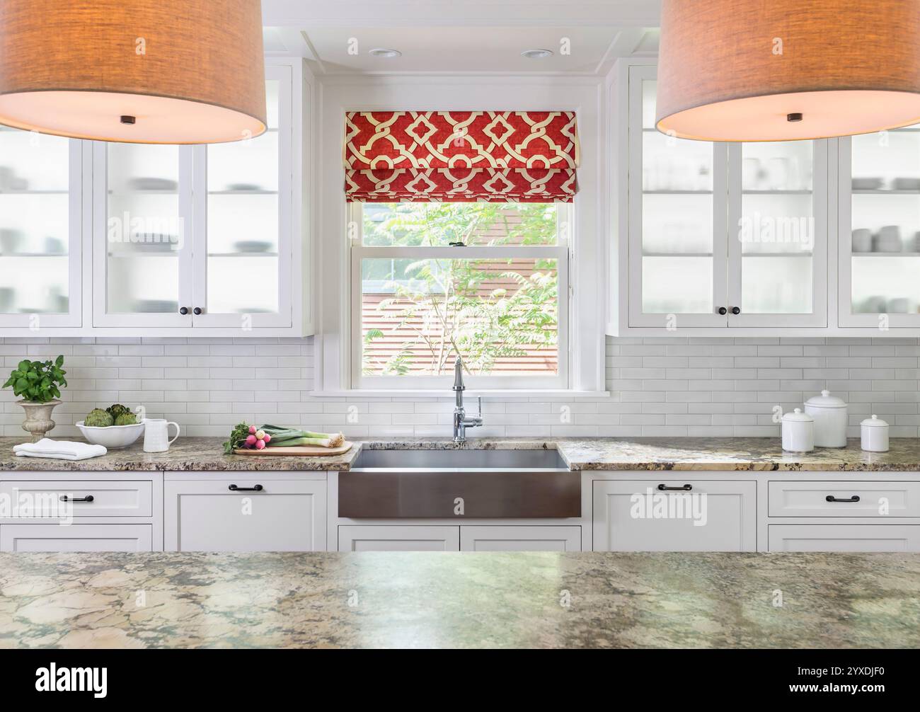 Kitchen counter showing sink and natural light coming through windows ...