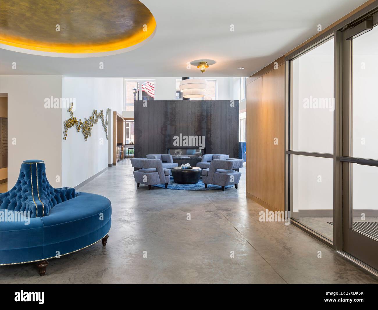 Entrance lobby to new apartment building with blue velvet lobby sofa ...