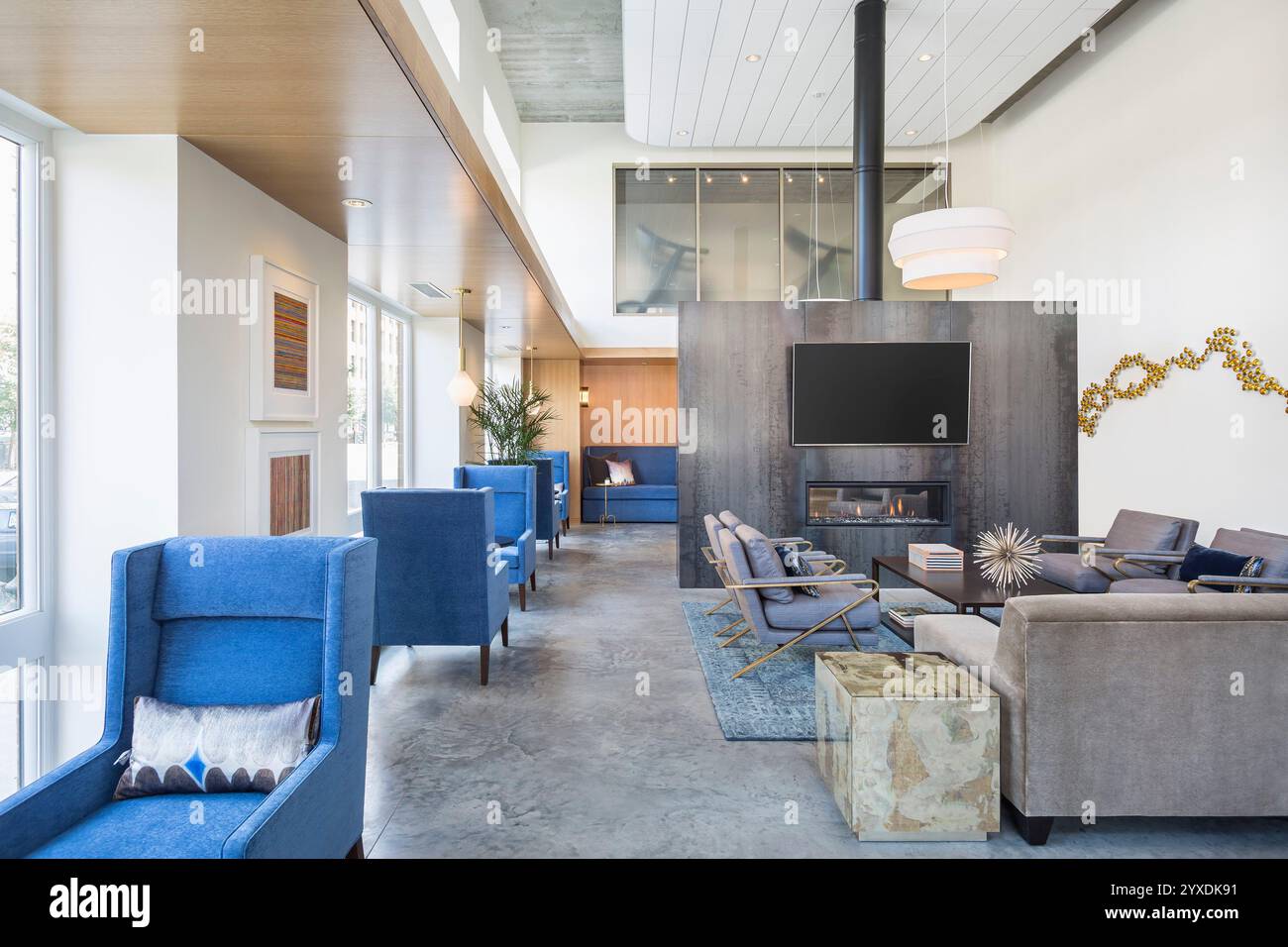 Lounge and television area in lobby of new apartment building with view ...