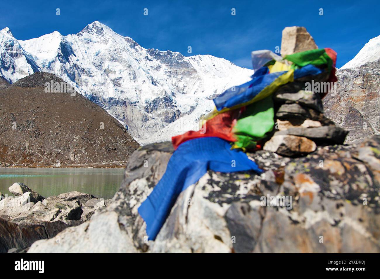 Mount Cho Oyu and stone pyramid with prayer flags, way to Cho Oyu base ...