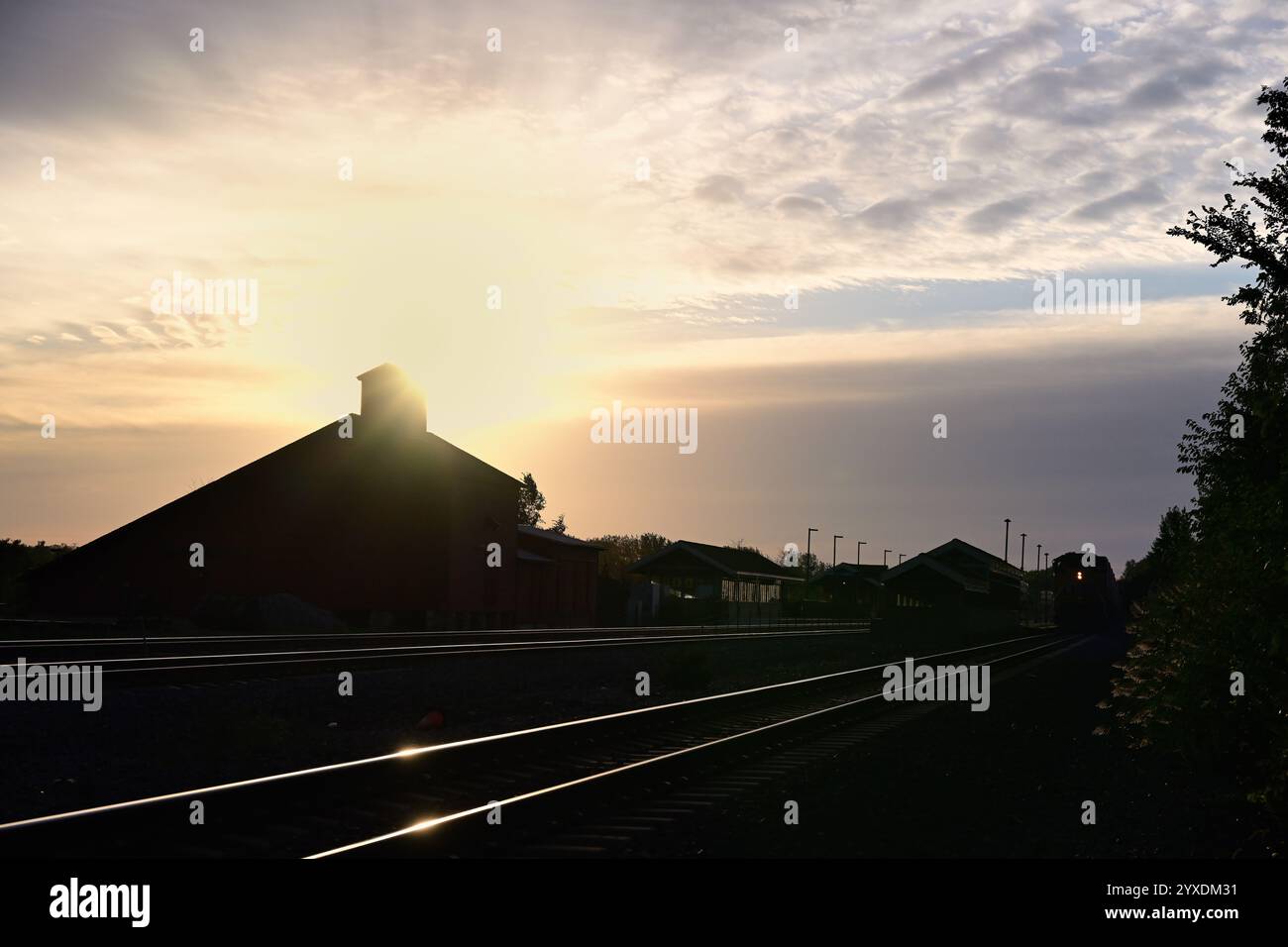 La Fox, Illinois, USA. A headlight from a waiting freight train shines ...