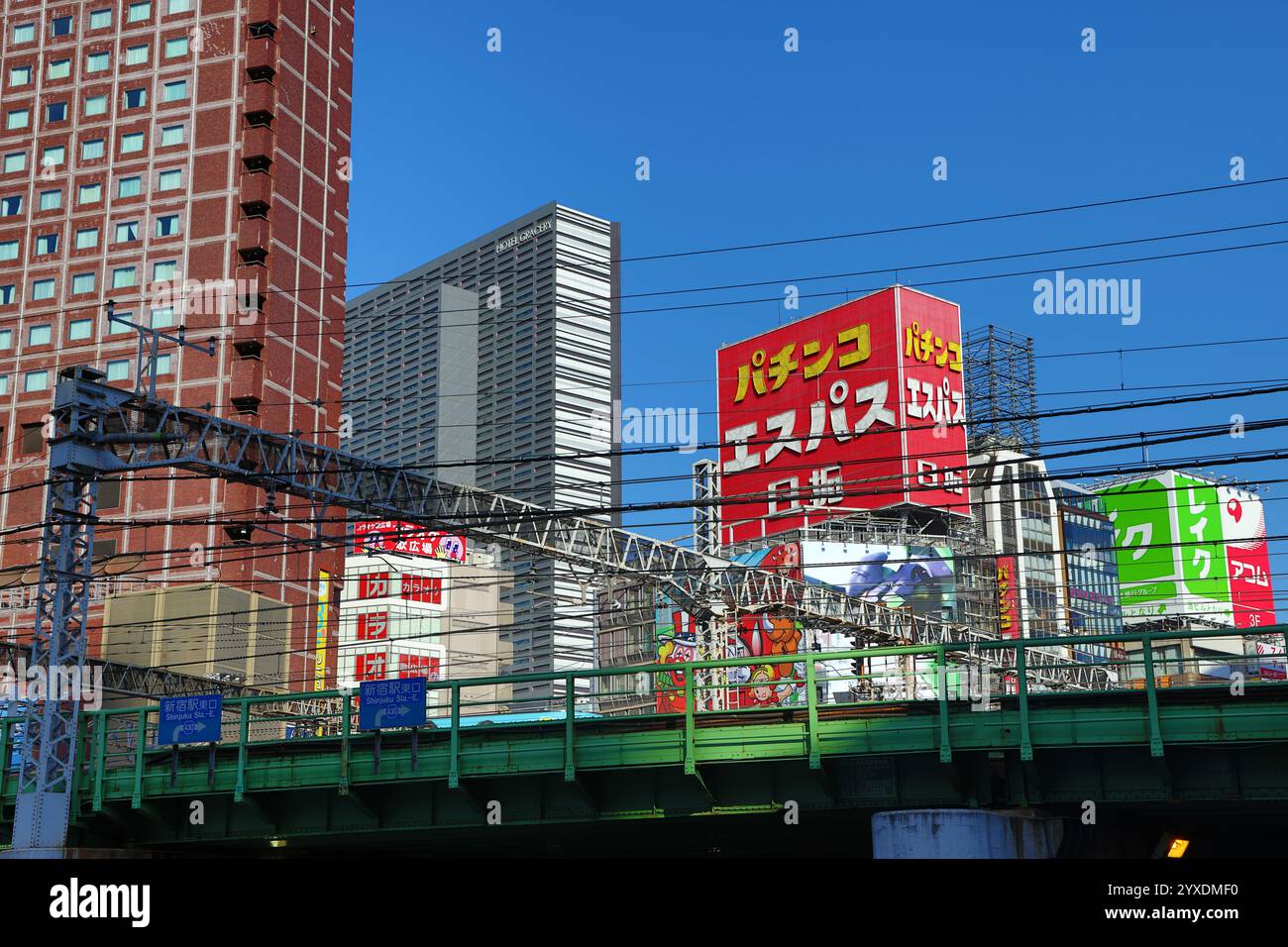Buildings along the skyline of Kabukicho and train tracks in Shinjuku ...
