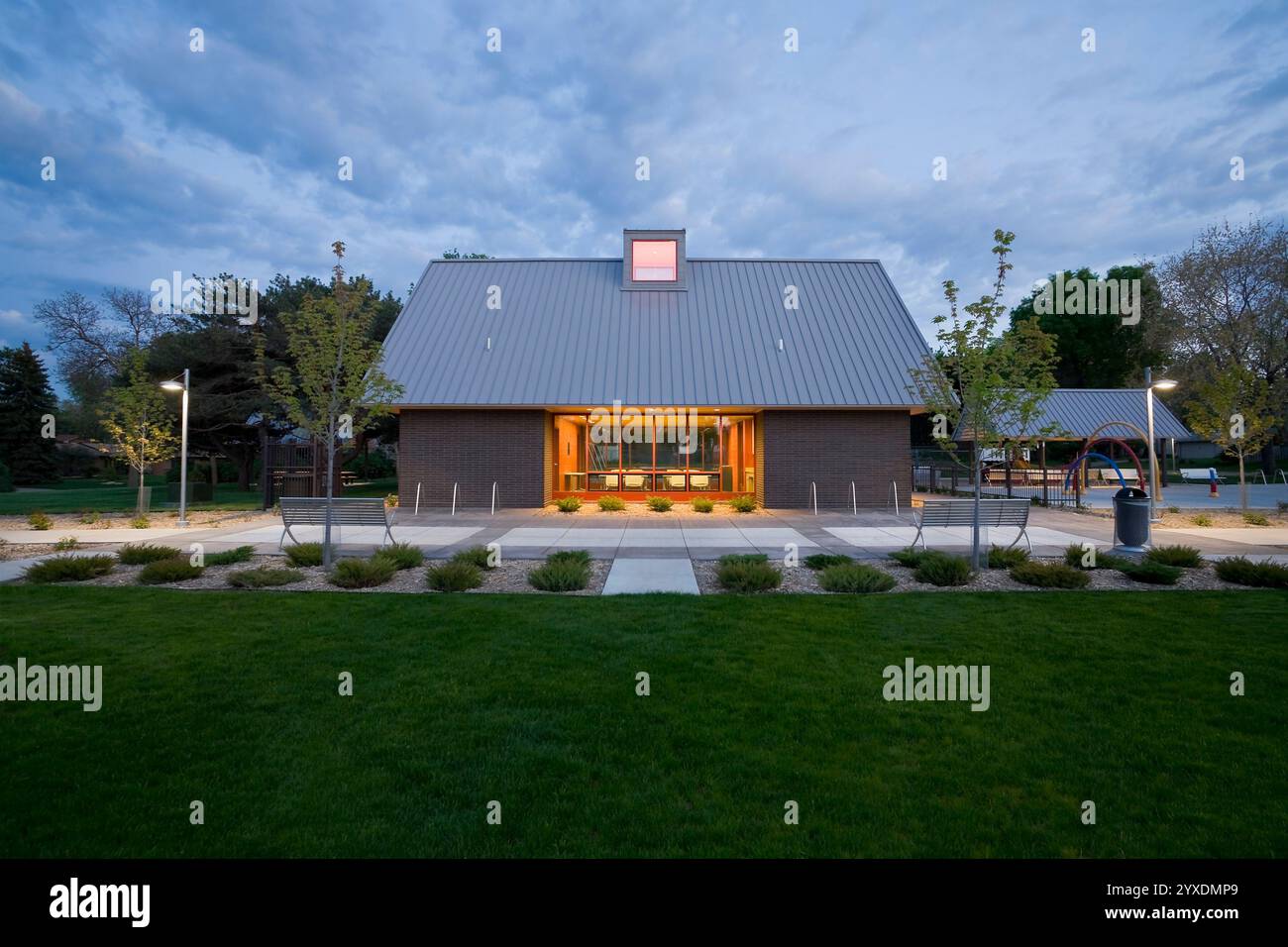 Elevation view of modern park structures lit up at dusk Stock Photo - Alamy