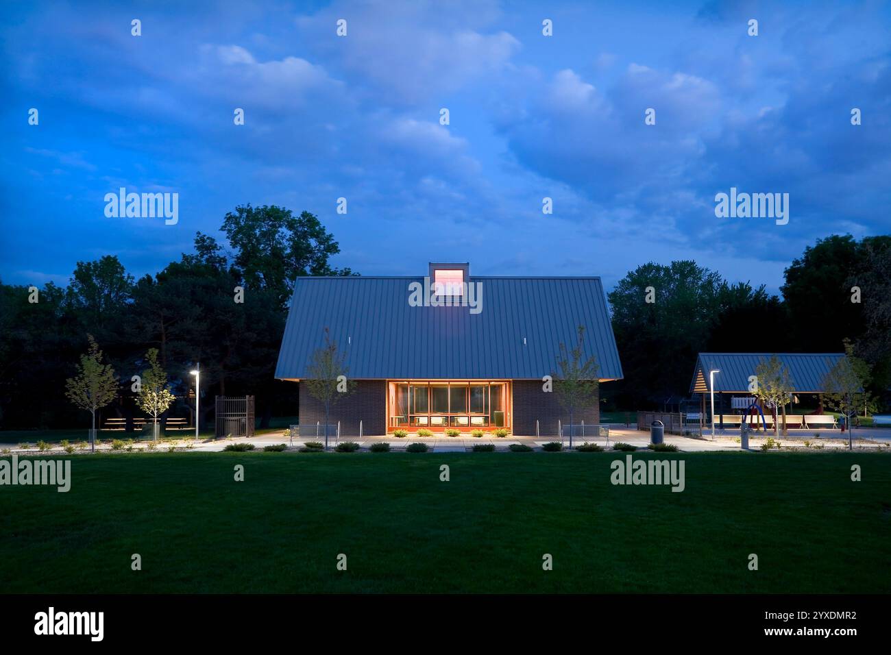 Larger elevation view of modern park structures lit up at dusk Stock ...
