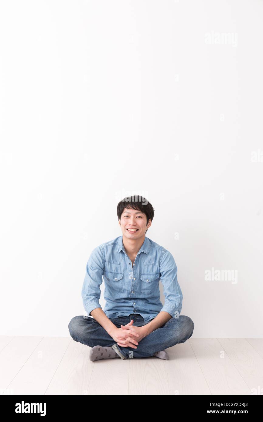 Cross legged young man hi-res stock photography and images - Alamy