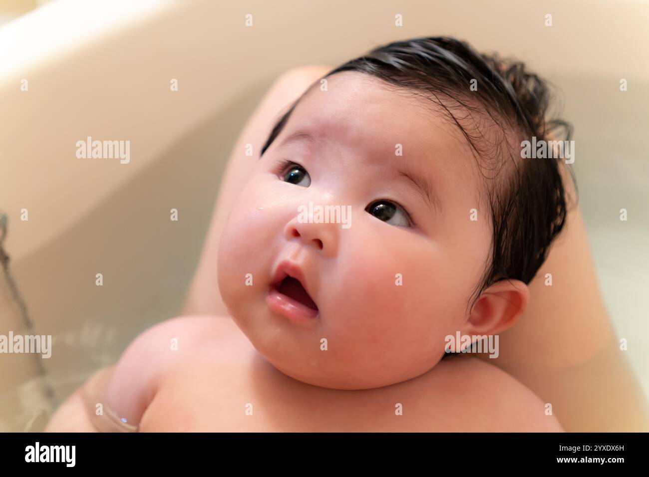 Baby in bath Stock Photo - Alamy