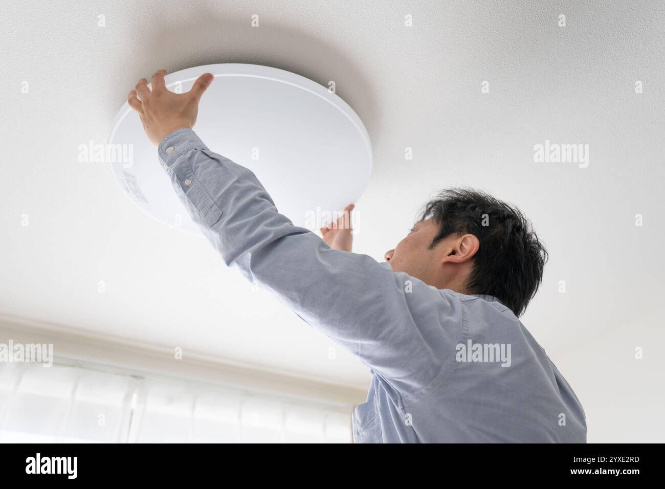 Replacement of indoor lights Stock Photo - Alamy