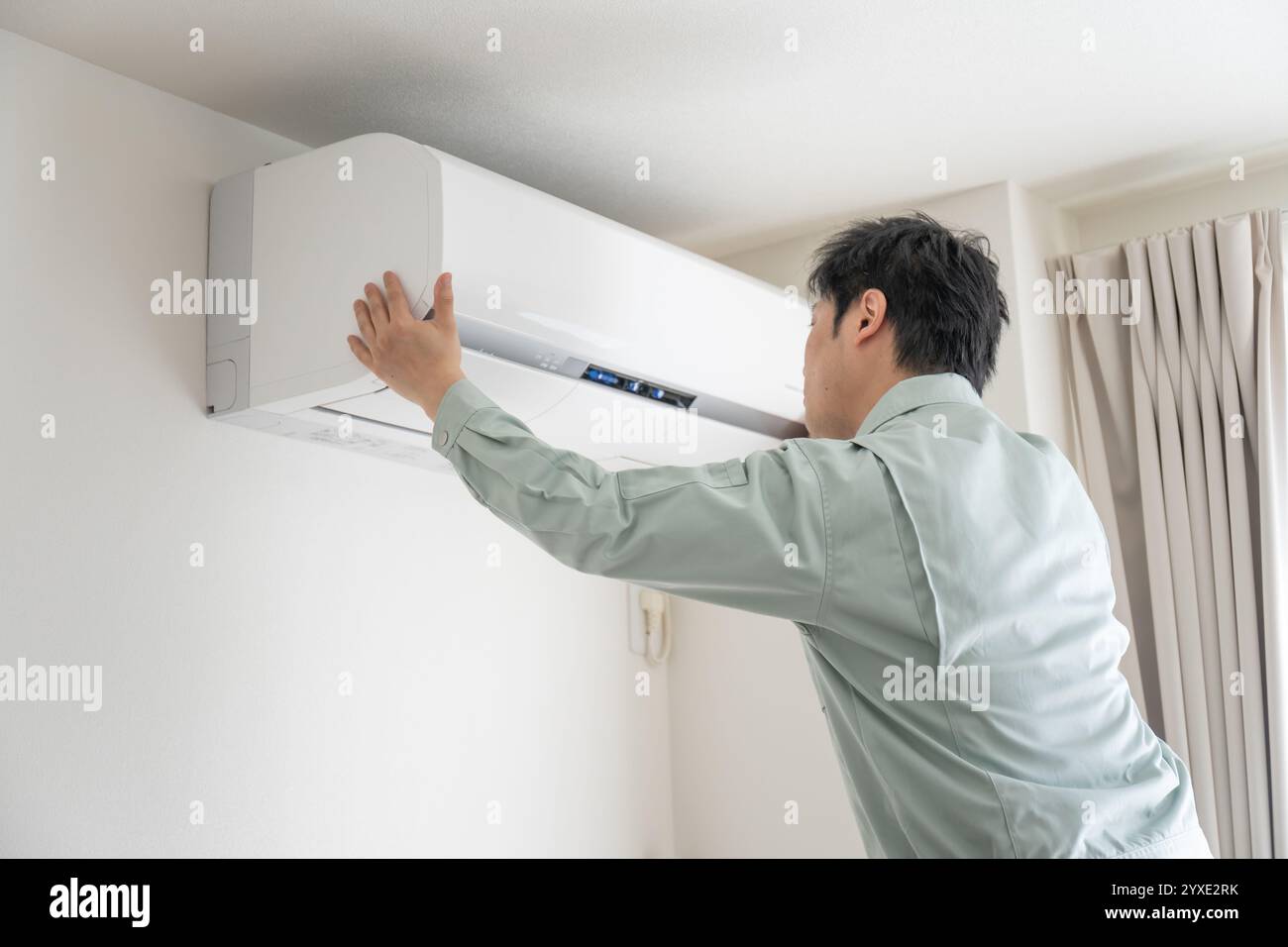 Air conditioner inspection Stock Photo - Alamy