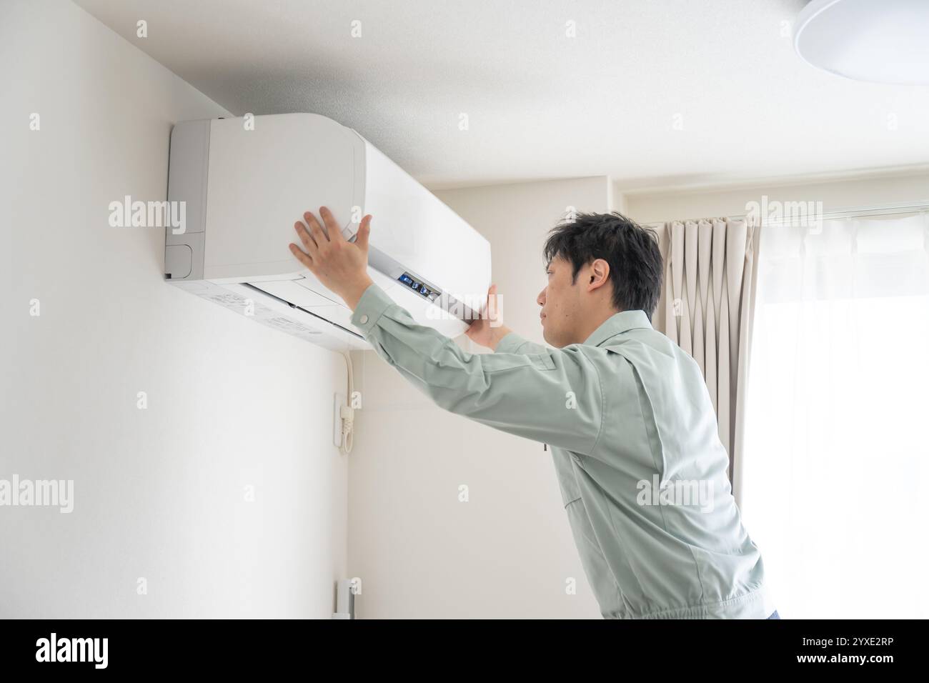 Air conditioner inspection Stock Photo - Alamy