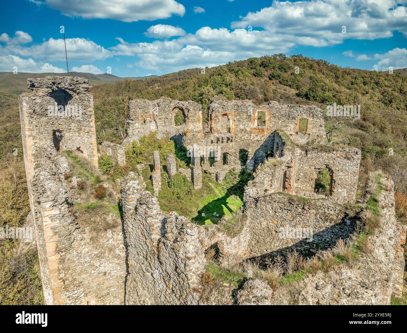 Aerial view of Soimos medieval castle ruin above the Mures river in ...