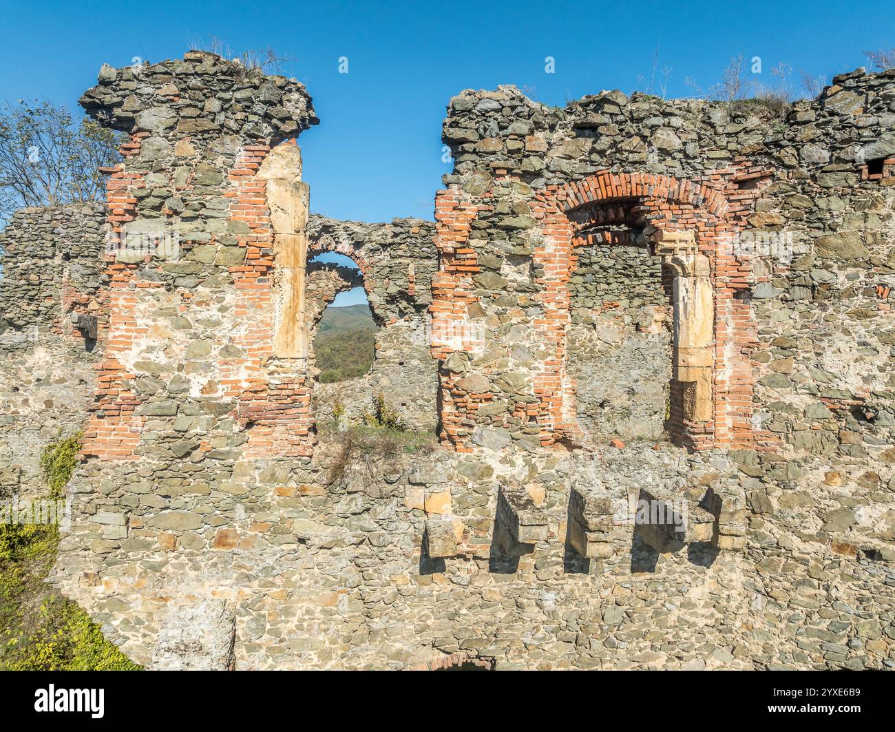 Aerial view of Soimos medieval castle ruin above the Mures river in ...