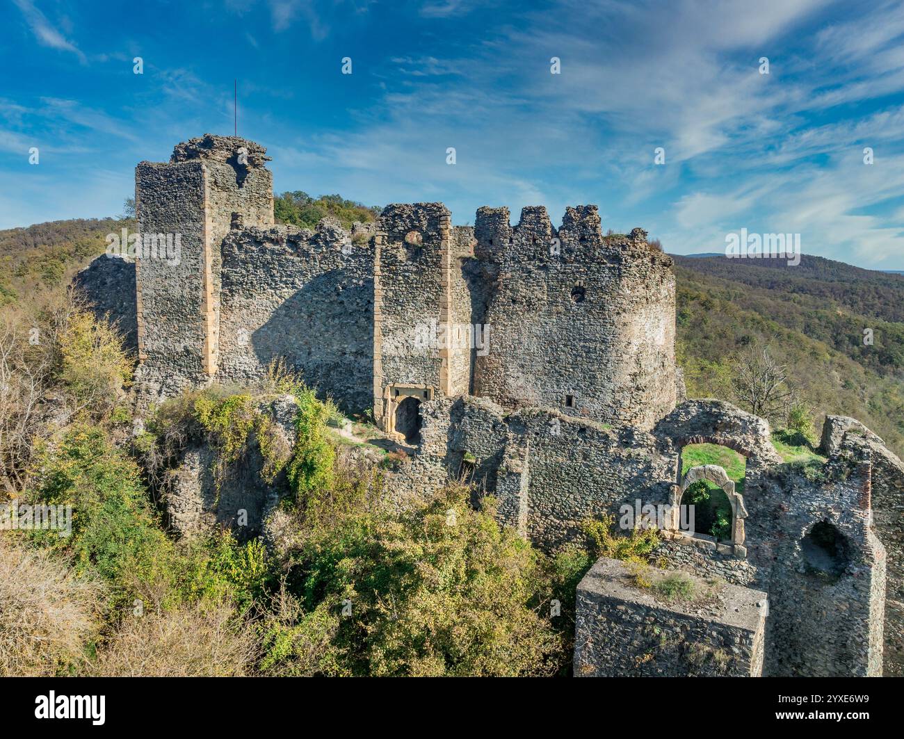 Aerial view of Soimos medieval castle ruin above the Mures river in ...