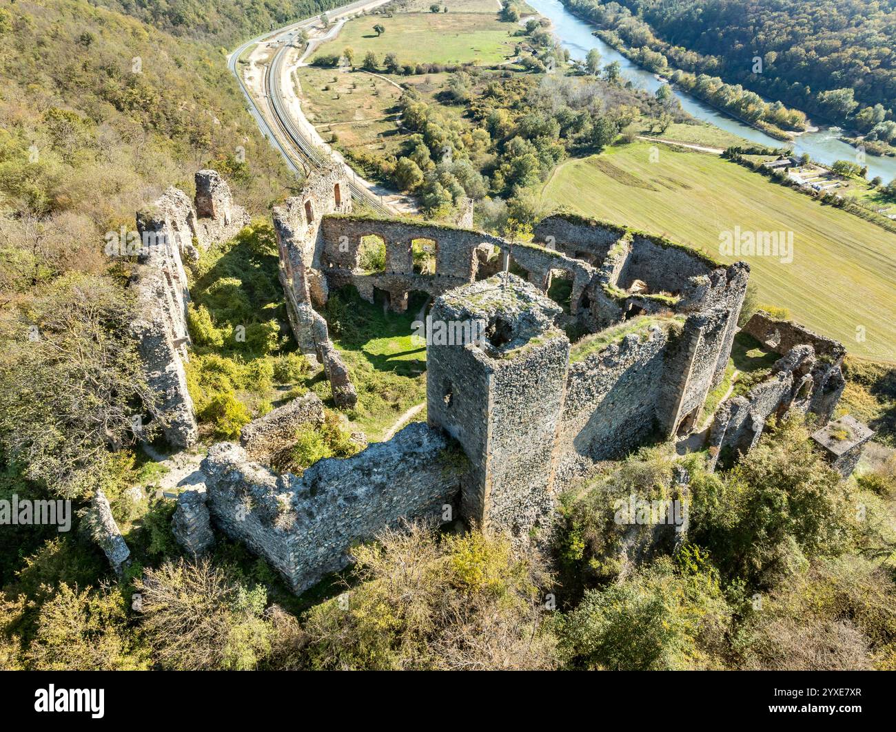Aerial view of Soimos medieval castle ruin above the Mures river in ...