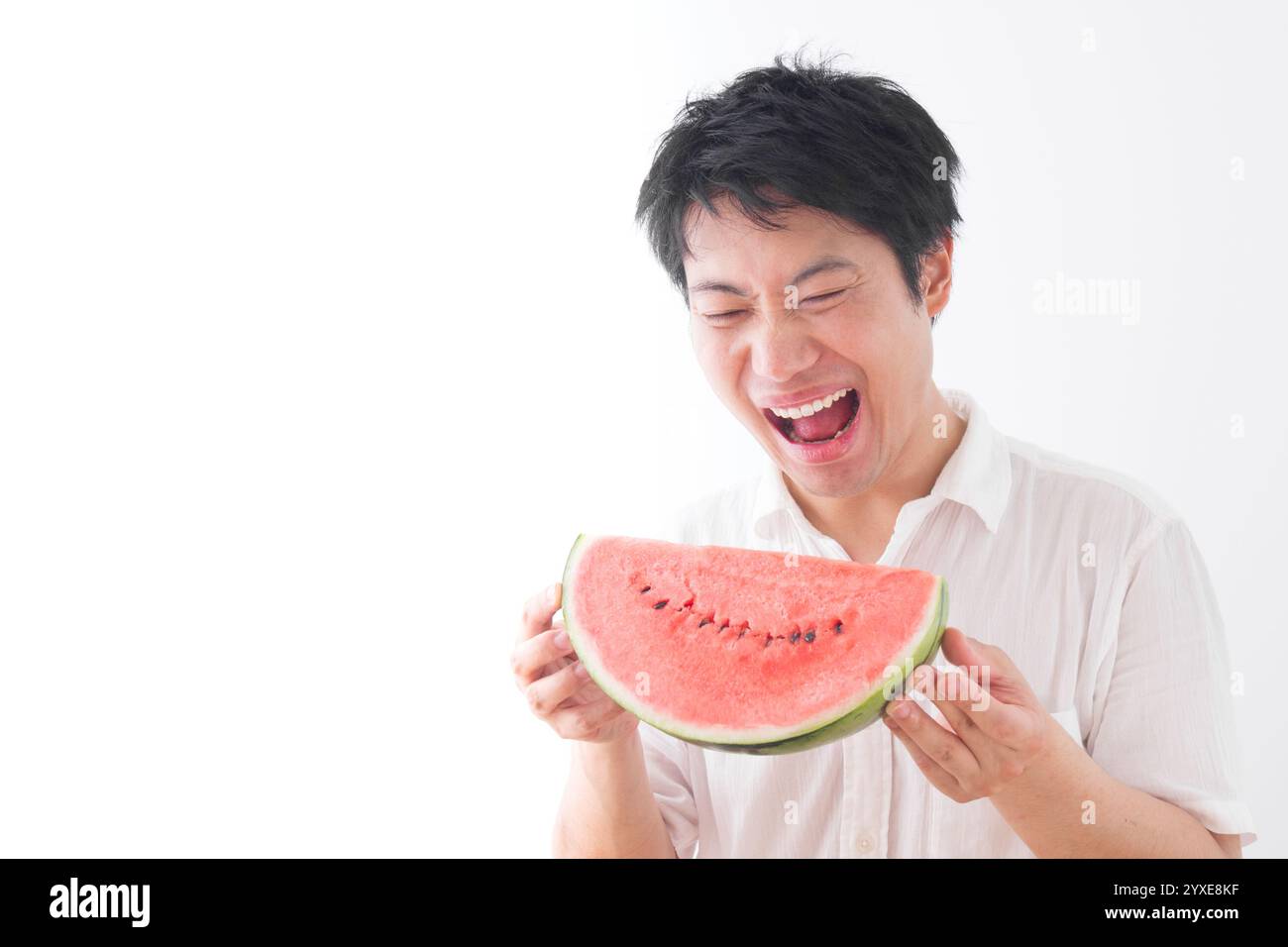 Man eating watermelon Stock Photo - Alamy