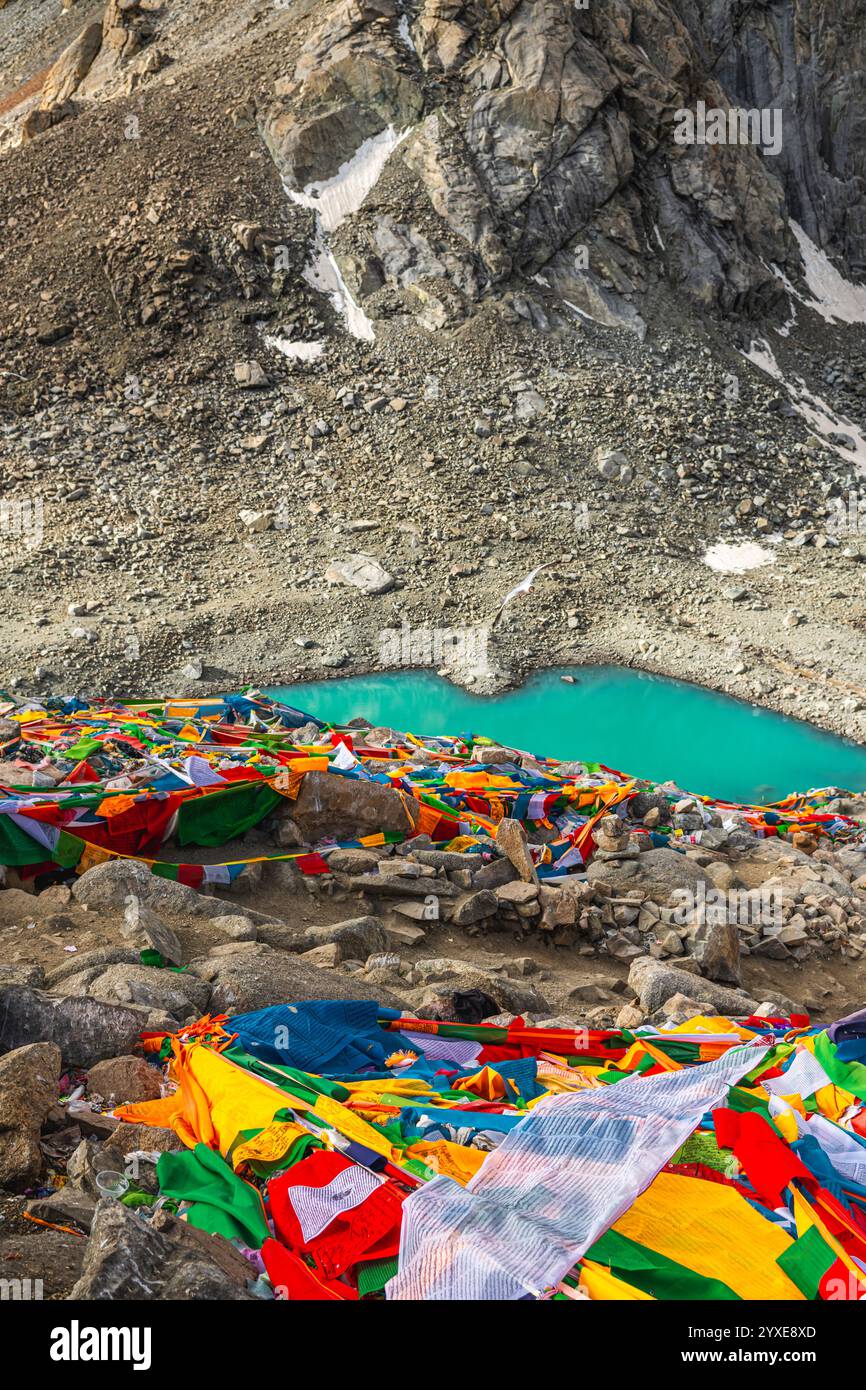 Tibetan praying flags at the Gauri Kund mountain lake during the ritual ...