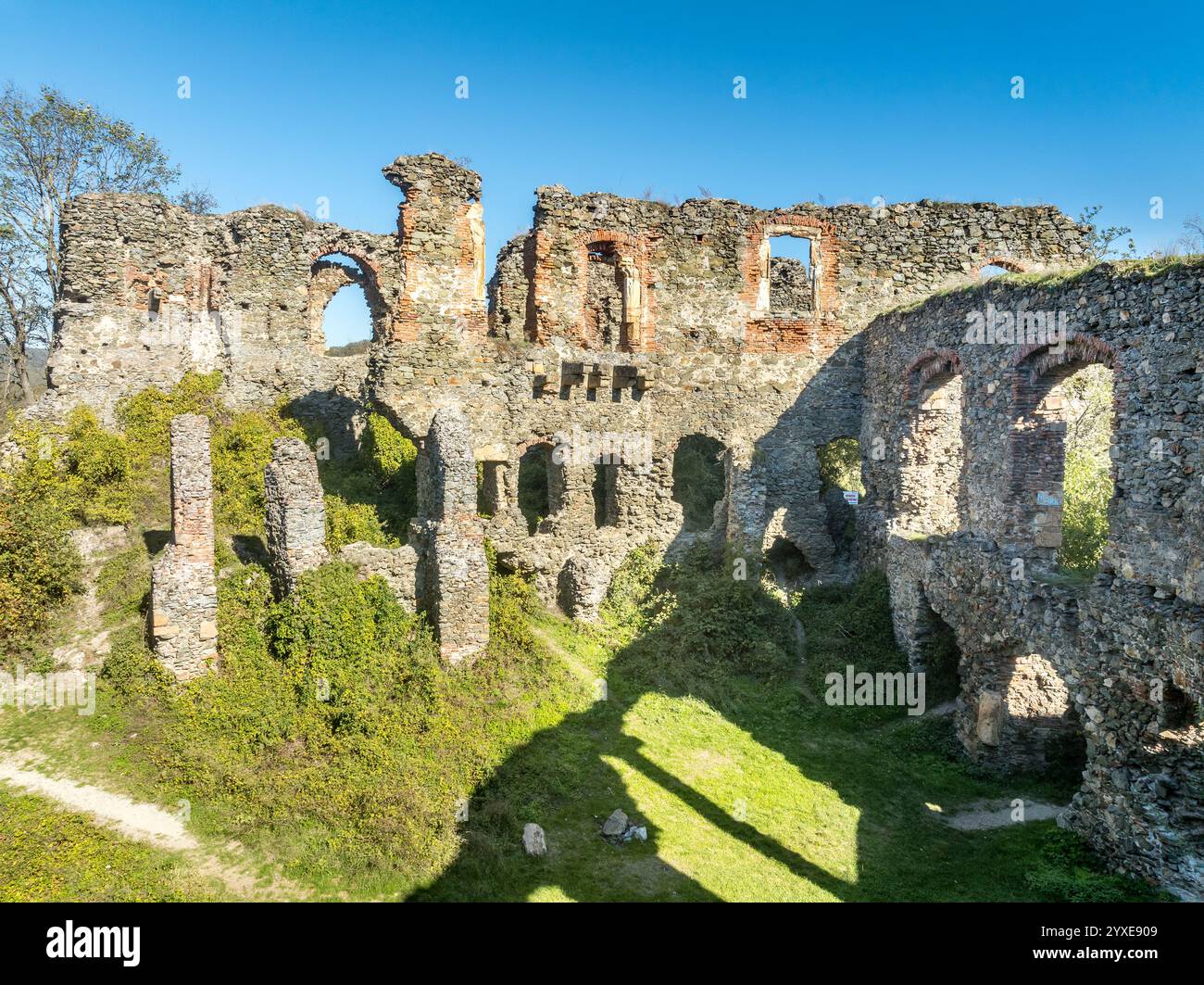 Aerial view of Soimos medieval castle ruin above the Mures river in ...