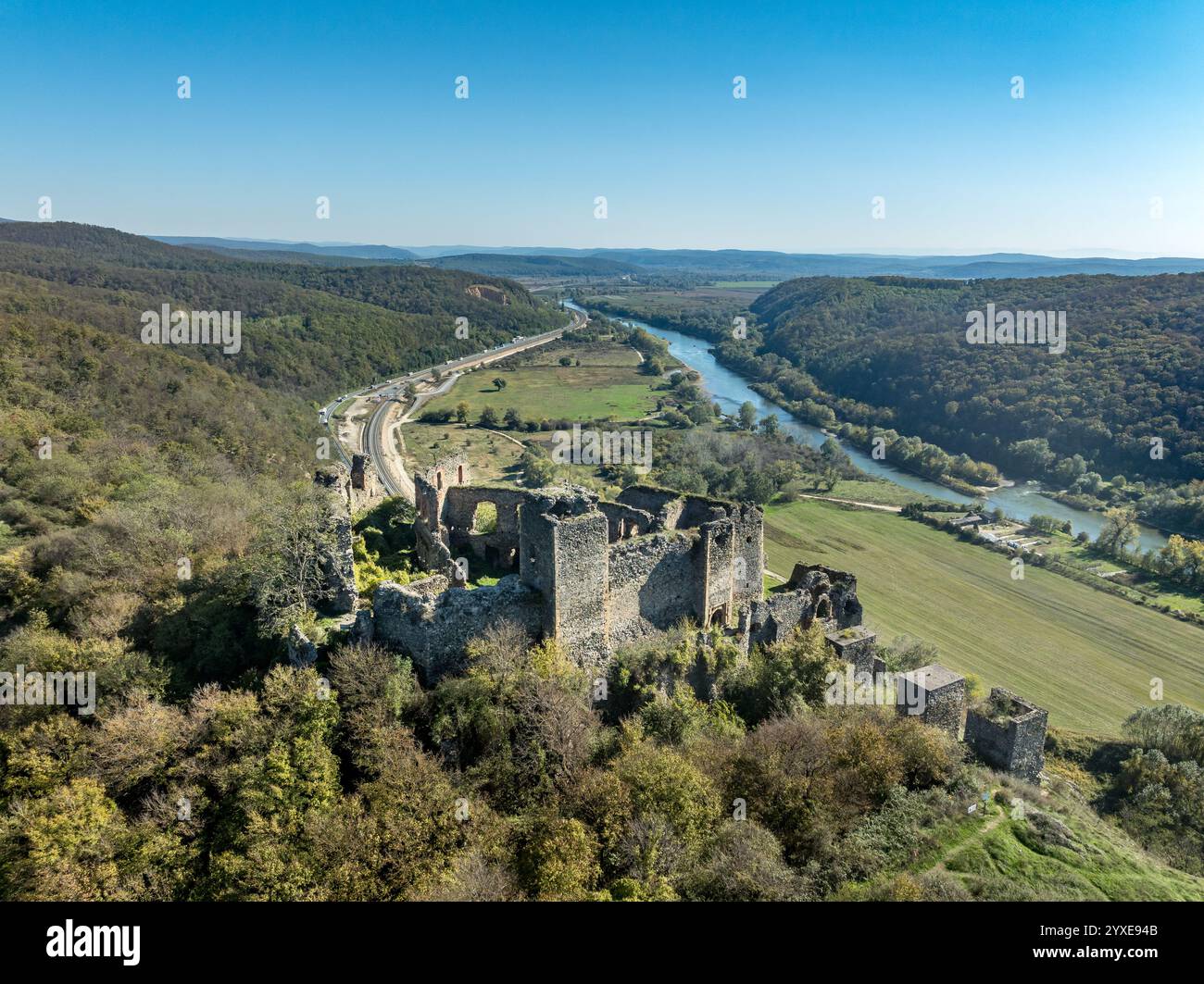 Aerial view of Soimos medieval castle ruin above the Mures river in ...