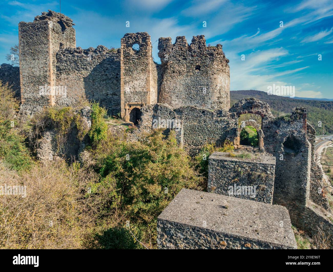 Aerial view of Soimos medieval castle ruin above the Mures river in ...