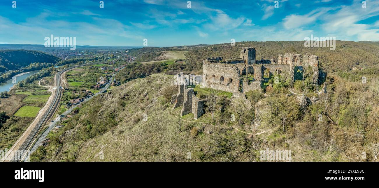 Aerial view of Soimos medieval castle ruin above the Mures river in ...