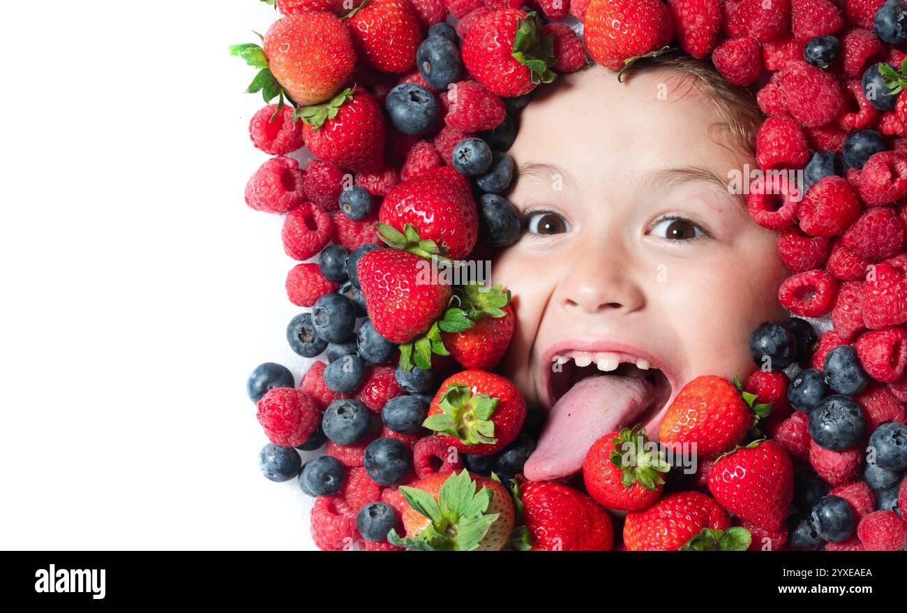 Healthy eating for children. Kids face with berries mix of strawberry ...