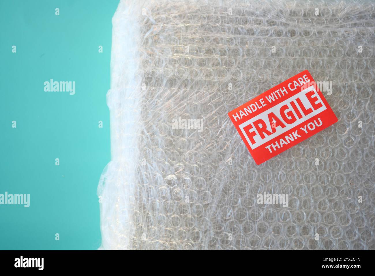 A cardboard box marked with a caution label for fragile goods handling during shipping Stock ...