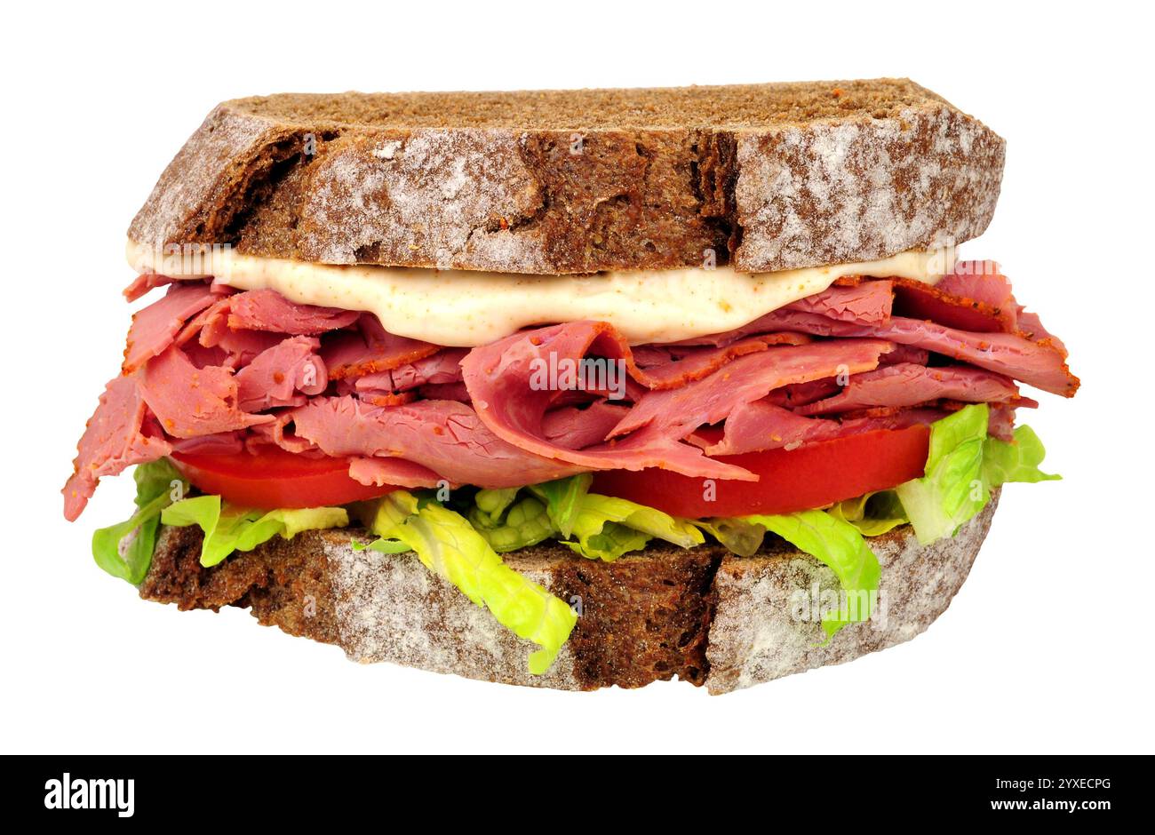 Pastrami and salad sandwich in sliced German style crusty sourdough rye ...