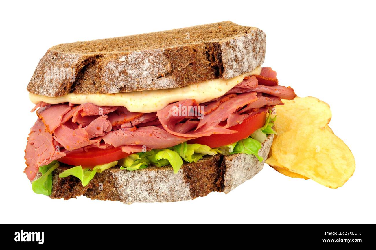 Pastrami and salad sandwich in sliced German style crusty sourdough rye ...