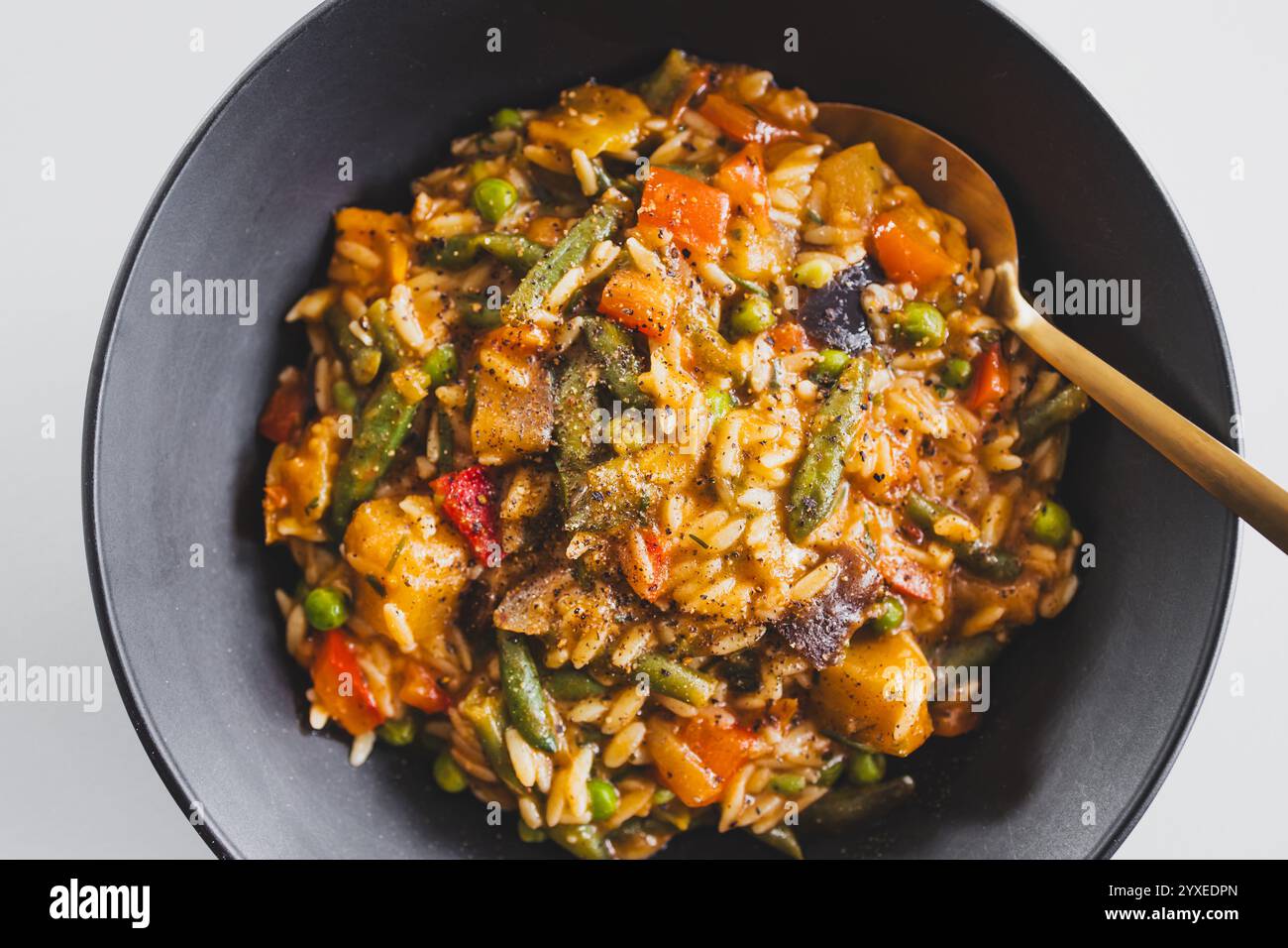 Mediterranean risoni with mixed vegetables and tomato sauce , healthy ...