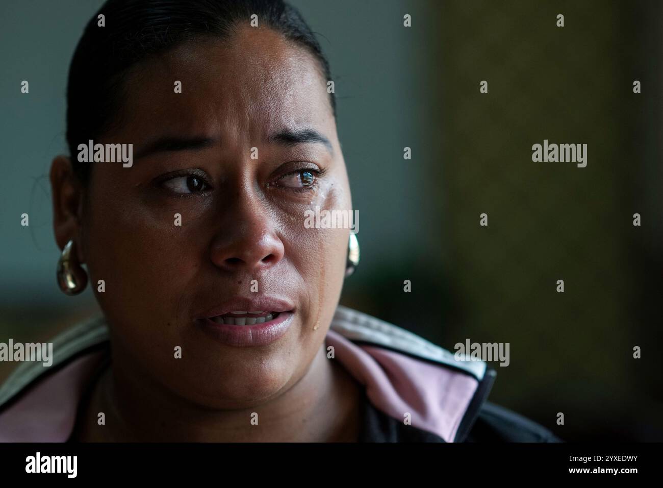Larissa Martinez, who was deported from the U.S. in 2021 with her three children, reacts during ...