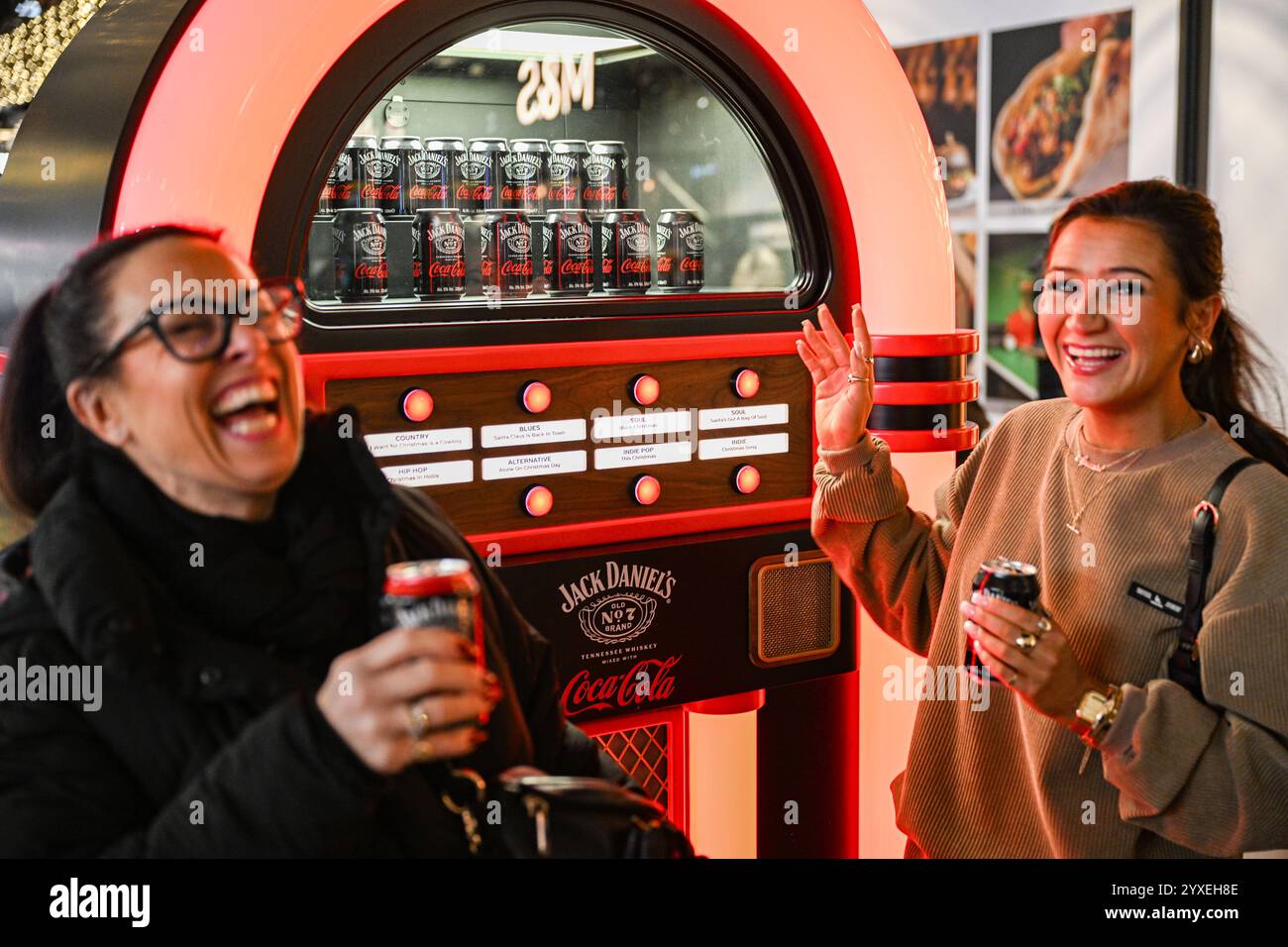 EDITORIAL USE ONLY Members of the public pick alternative festive songs ...