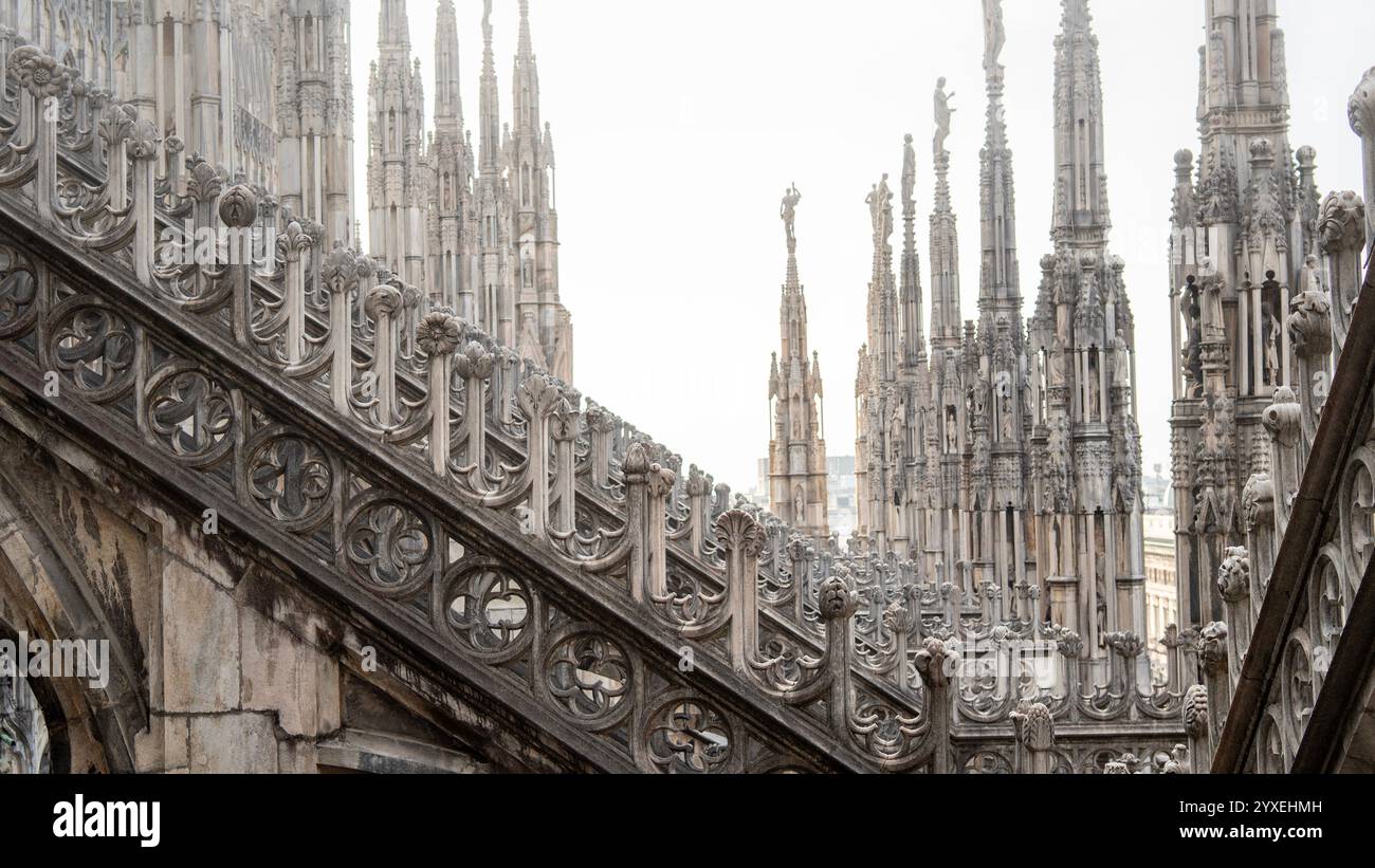 The image shows the intricate Gothic architecture of Milan's iconic ...
