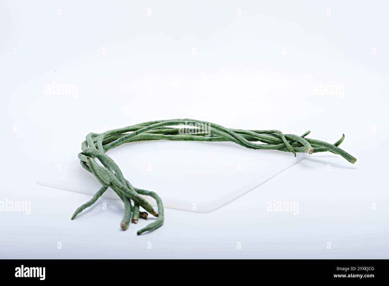 Fresh long beans photographed on a white background Stock Photo - Alamy
