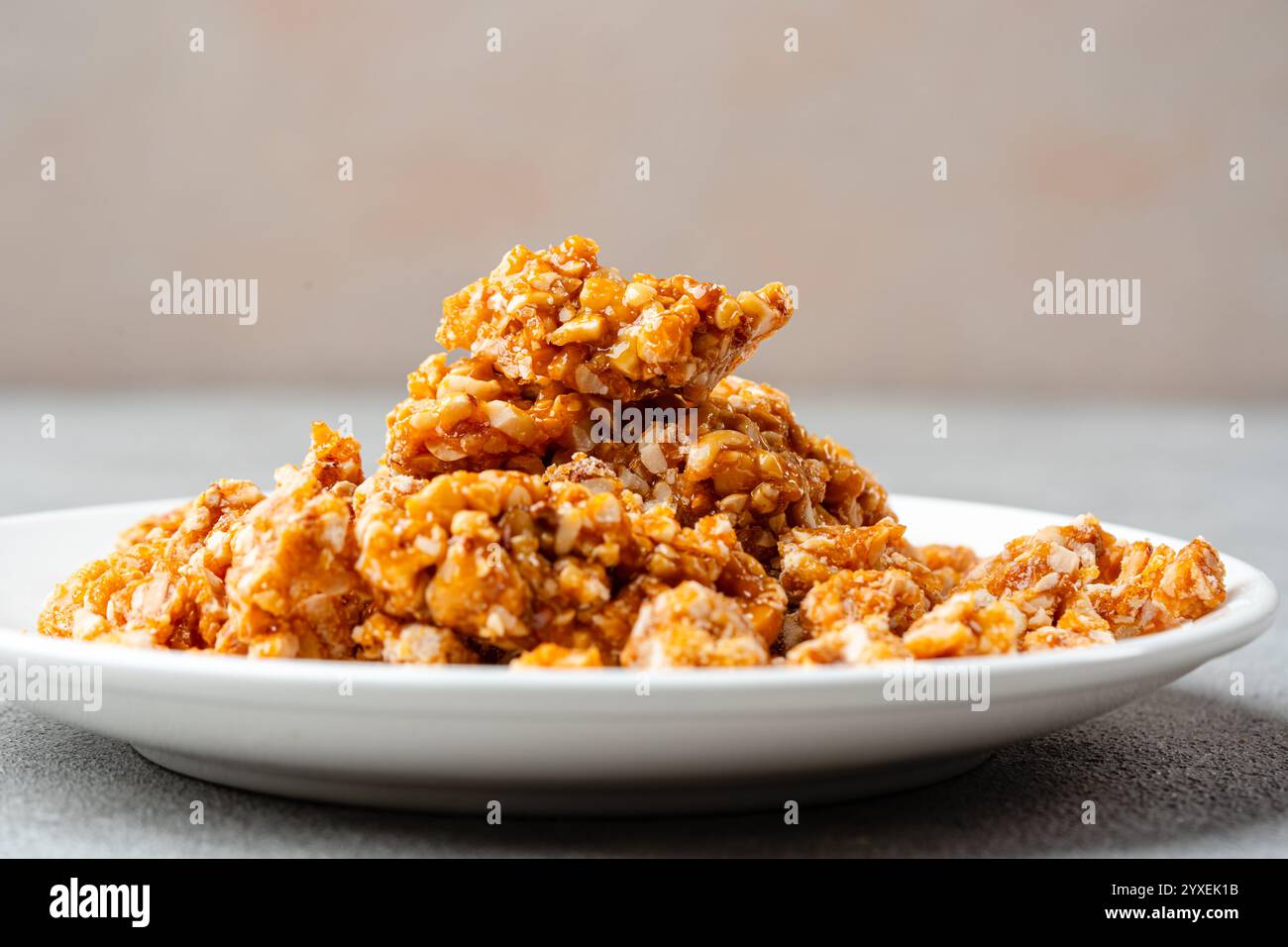 Crushed caramel peanut brittle is usually used for topping cakes ...