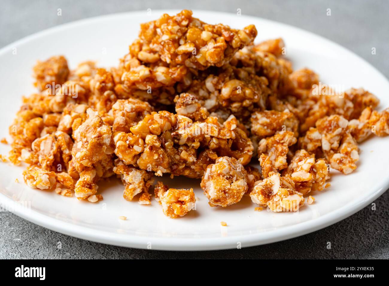 Crushed caramel peanut brittle is usually used for topping cakes ...