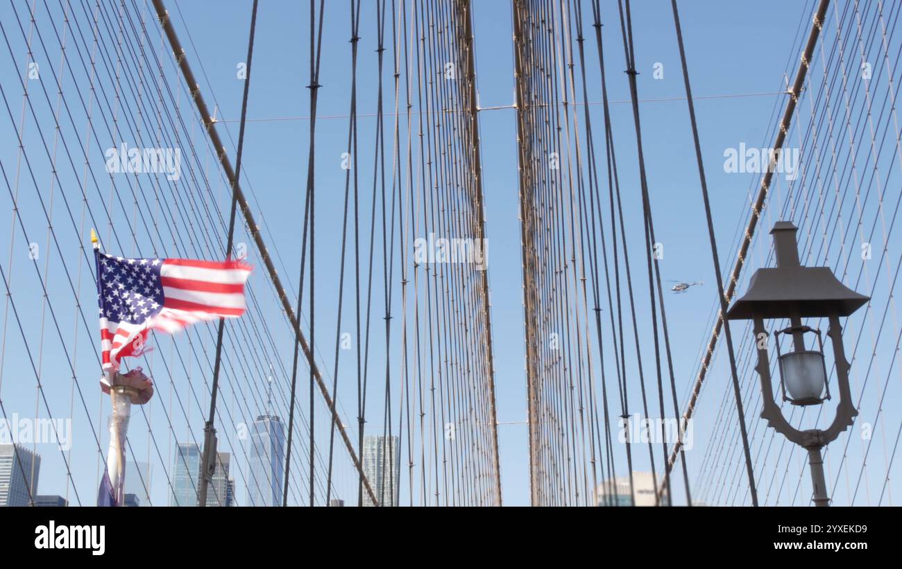 American flag on Brooklyn Bridge to Manhattan, New York City. Patriotic ...