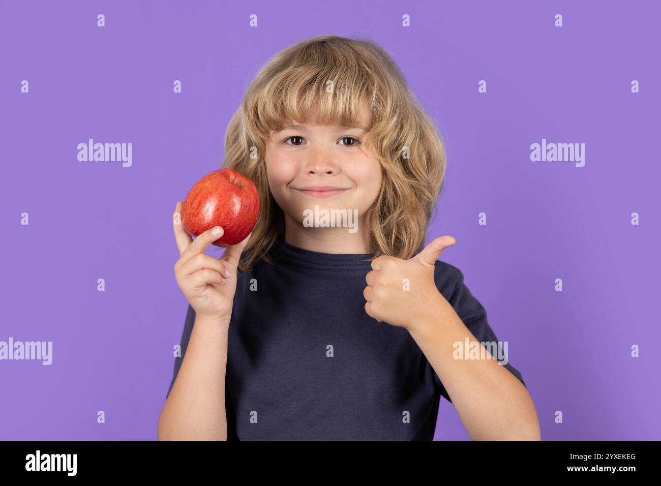 Happy smiling child girl hold apple, health. Studio portrait Stock ...