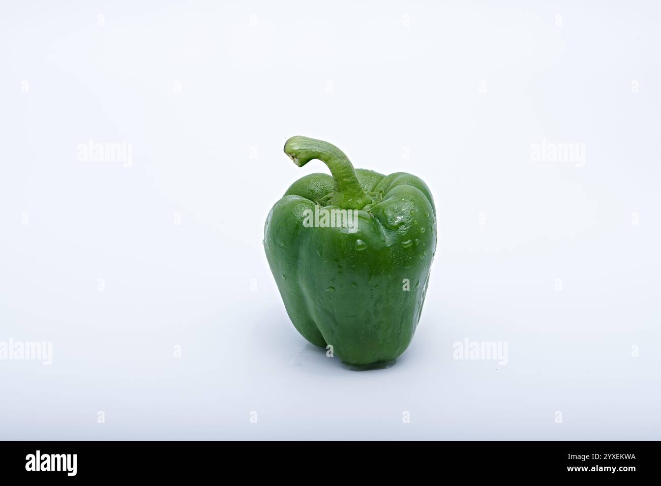 Fresh green peppers photographed on a white background Stock Photo - Alamy