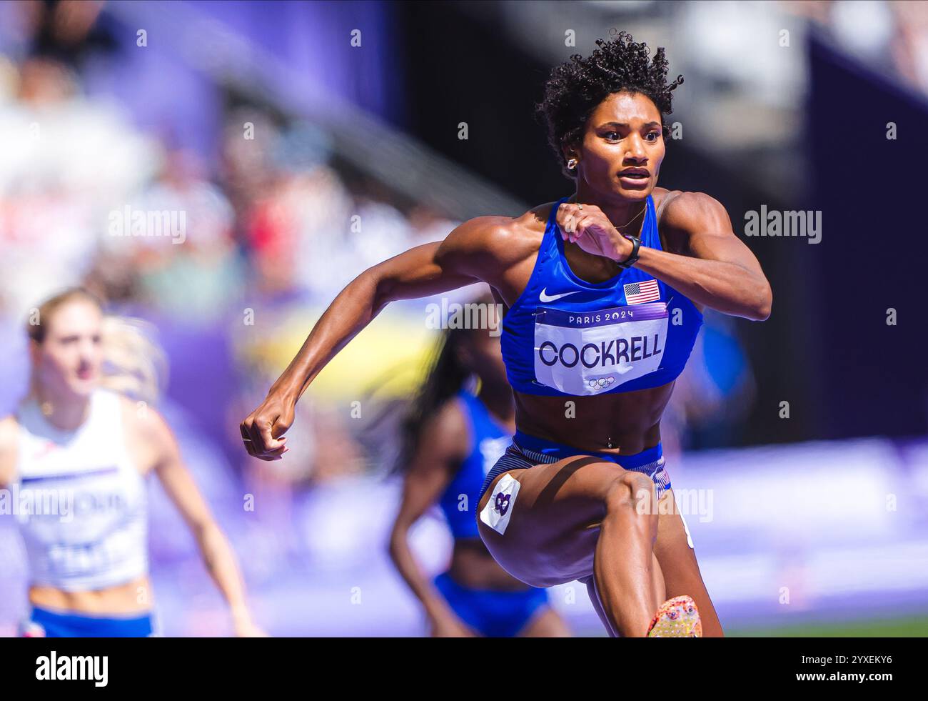Anna Cockrell participating in the 400 meters hurdles at the Paris 2024 ...
