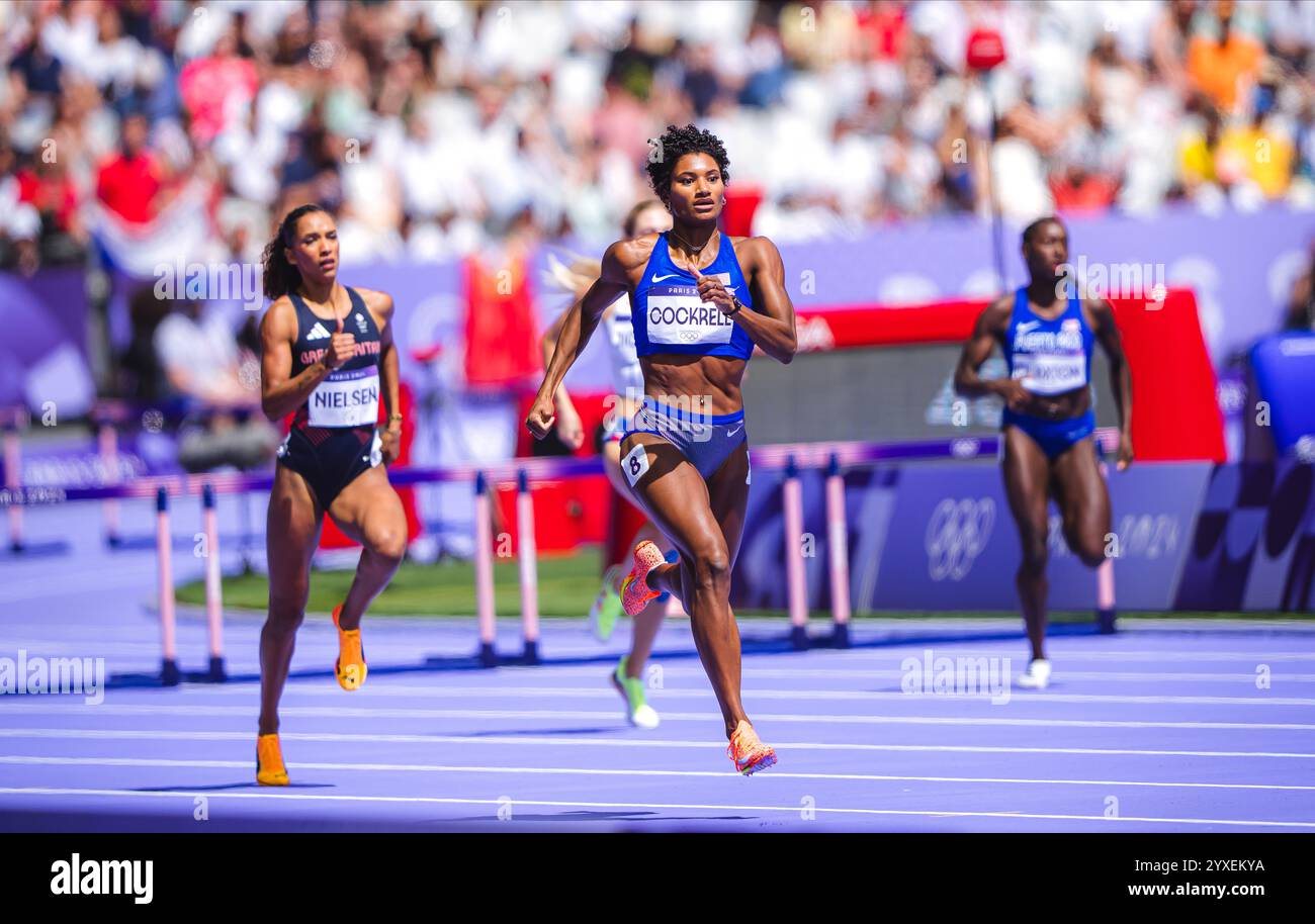Anna Cockrell participating in the 400 meters hurdles at the Paris 2024 ...