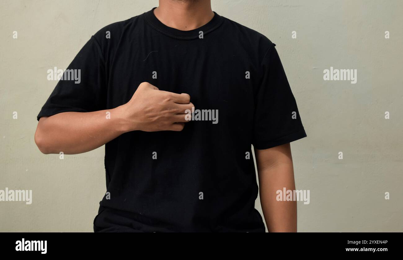 Young man gesturing SORRY in sign language, deaf and dumb person ...